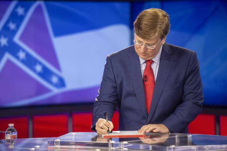 After waffling for years, Gov. Tate Reeves signs bill to change state ...